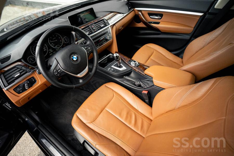 Black BMW 320 2013 in Riga, with an engine capacity of 2.00 L and mileage of 235 thousand km for 11990 €, photo 13 on AUTOMOTO.COM.LV