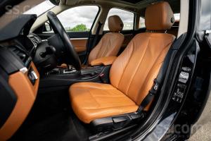 Black BMW 320 2013 in Riga, with an engine capacity of 2.00 L and mileage of 235 thousand km for 11990 €, photo 14 on AUTOMOTO.COM.LV