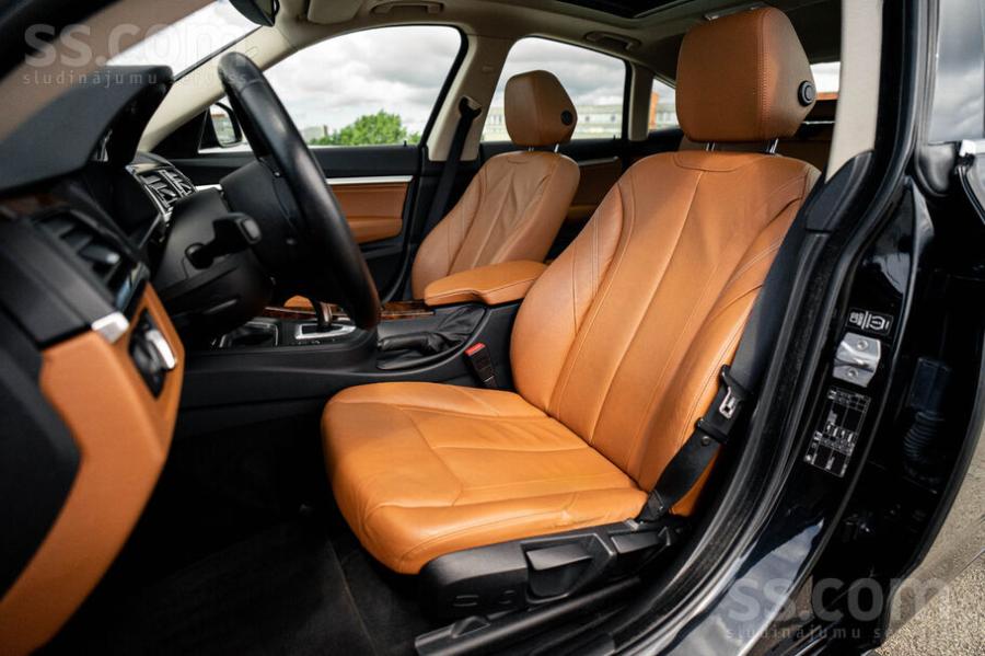 Black BMW 320 2013 in Riga, with an engine capacity of 2.00 L and mileage of 235 thousand km for 11990 €, photo 14 on AUTOMOTO.COM.LV