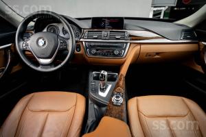 Black BMW 320 2013 in Riga, with an engine capacity of 2.00 L and mileage of 235 thousand km for 11990 €, photo 15 on AUTOMOTO.COM.LV