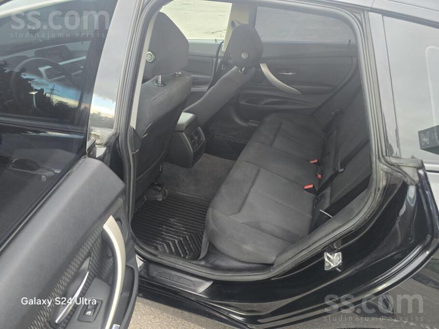 Black BMW 320 2016 in Riga, with an engine capacity of 2.00 L and mileage of 208 thousand km for 10100 €, photo 10 on AUTOMOTO.COM.LV