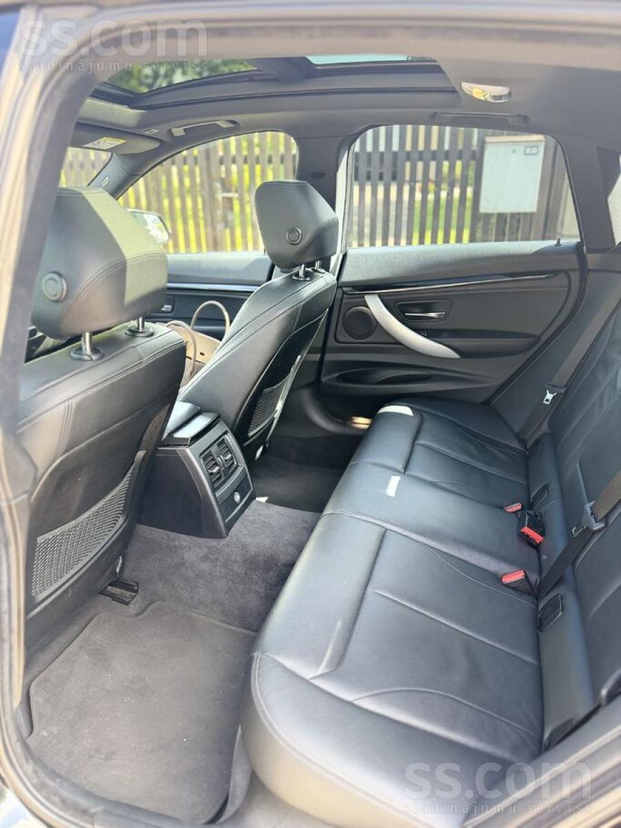 Black BMW 320 2018 in Riga, with an engine capacity of 2.00 L and mileage of 281 thousand km for 15000 €, photo 8 on AUTOMOTO.COM.LV