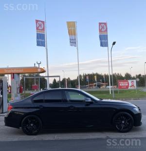 Black BMW 320 2012 in Riga, with an engine capacity of 2.00 L and mileage of 214 thousand km for 13400 €, photo 6 on AUTOMOTO.COM.LV