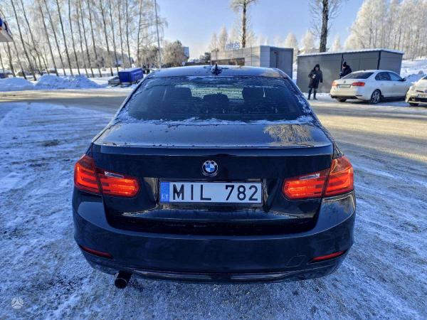 Black BMW 320 2012 in Vilnius, with an engine capacity of 2.00 L and mileage of 312 thousand km for 8500 €, photo 6 on AUTOMOTO.COM.LV