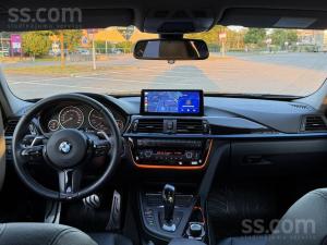Black BMW 320 2013 in Riga, with an engine capacity of 2.00 L and mileage of 127 thousand km for 13990 €, photo 12 on AUTOMOTO.COM.LV