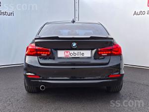 Black BMW 320 2013 in Riga, with an engine capacity of 2.00 L and mileage of 127 thousand km for 13950 €, photo 6 on AUTOMOTO.COM.LV