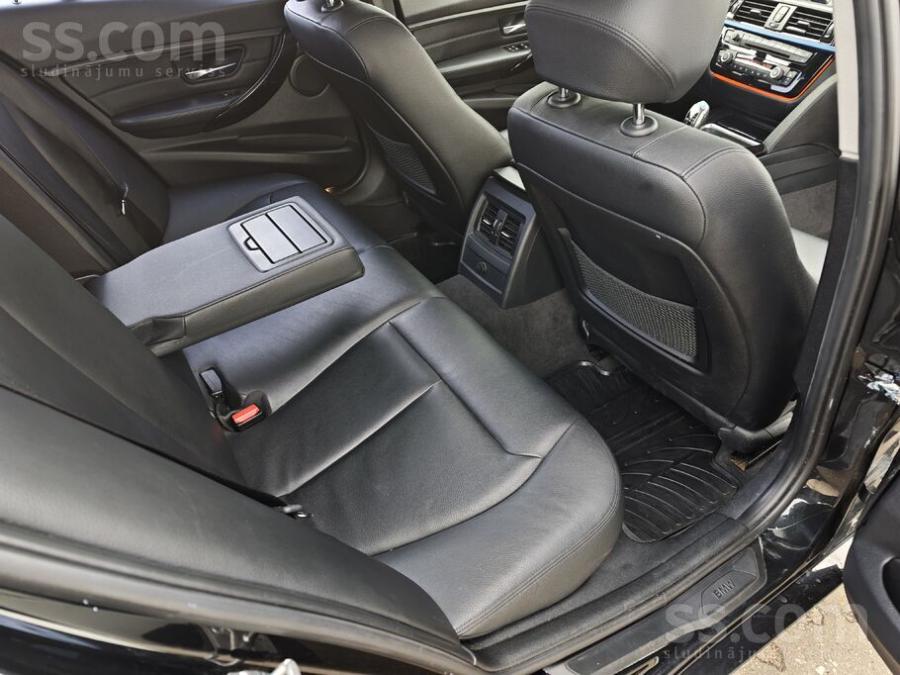 Black BMW 320 2013 in Riga, with an engine capacity of 2.00 L and mileage of 127 thousand km for 13950 €, photo 18 on AUTOMOTO.COM.LV