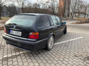 Black BMW 320 1997 in Riga, with an engine capacity of 2.00 L and mileage of 370 thousand km for 2390 €, photo 3 on AUTOMOTO.COM.LV