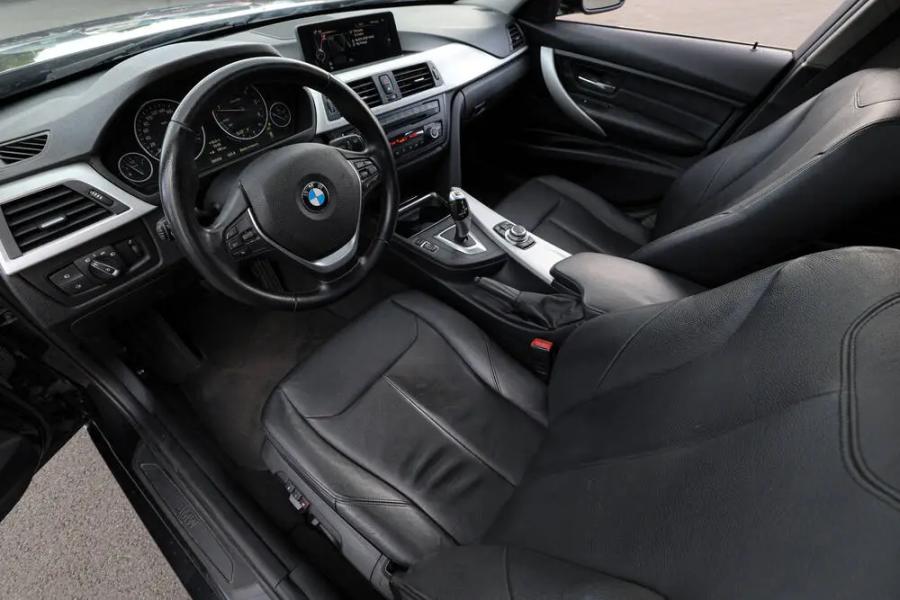 Black BMW 320 2012 in Jelgava, with an engine capacity of 2.00 L and mileage of 286 thousand km for 7650 €, photo 9 on AUTOMOTO.COM.LV