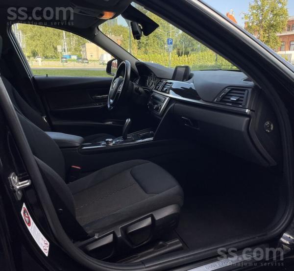 Black BMW 320 2013 in Riga, with an engine capacity of 2.00 L and mileage of 285 thousand km for 8450 €, photo 7 on AUTOMOTO.COM.LV
