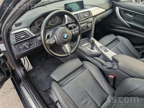 Black BMW 320 2013 in Riga, with an engine capacity of 2.00 L and mileage of 300 thousand km for 9400 €, photo 6 on AUTOMOTO.COM.LV