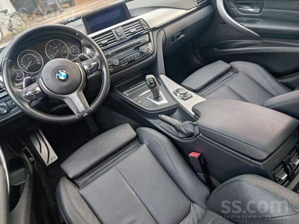 Black BMW 320 2013 in Riga, with an engine capacity of 2.00 L and mileage of 300 thousand km for 9400 €, photo 8 on AUTOMOTO.COM.LV