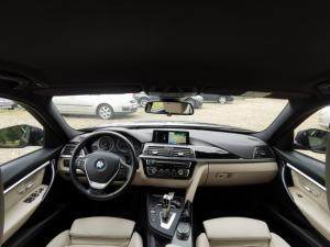 Black BMW 320 2018 in Riga, with an engine capacity of 2.00 L and mileage of 223 thousand km for 13900 €, photo 7 on AUTOMOTO.COM.LV