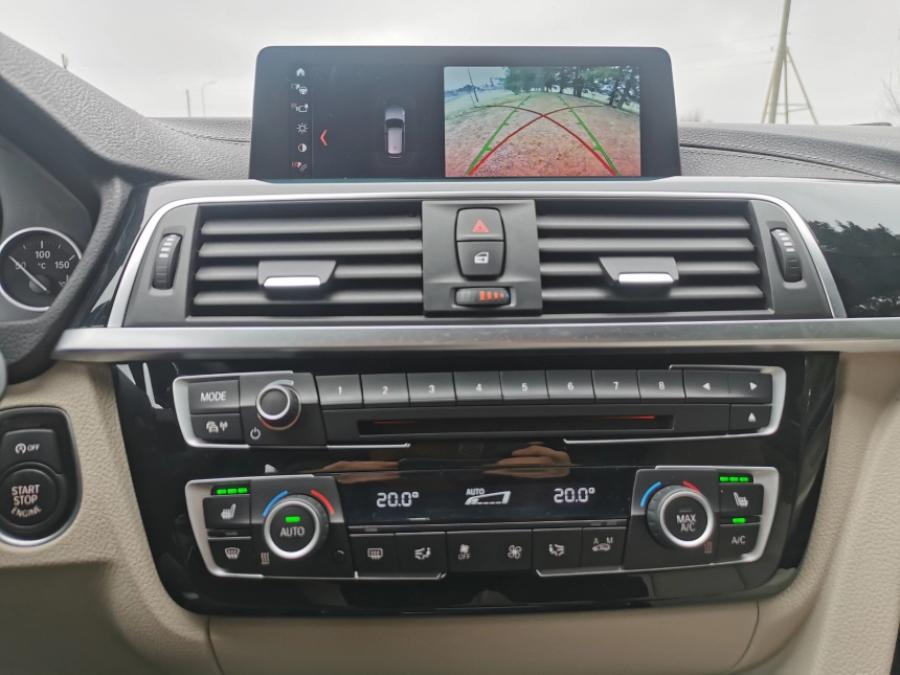 Black BMW 320 2018 in Riga, with an engine capacity of 2.00 L and mileage of 223 thousand km for 13900 €, photo 14 on AUTOMOTO.COM.LV