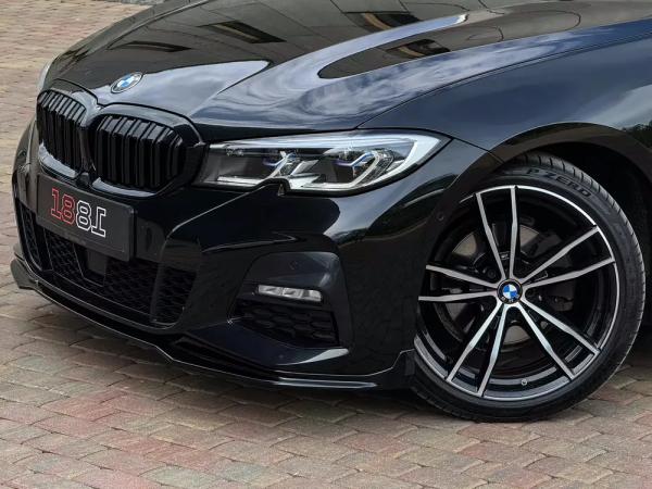 Black BMW 320 2021 in Riga, with an engine capacity of 2.00 L and mileage of 158 thousand km for 21900 €, photo 4 on AUTOMOTO.COM.LV