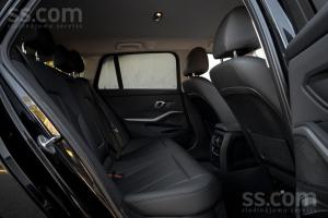 Black BMW 320 2021 in Jelgava, with an engine capacity of 2.00 L and mileage of 193 thousand km for 18500 €, photo 13 on AUTOMOTO.COM.LV