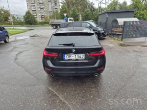 Black BMW 320 2021 in Riga, with an engine capacity of 2.00 L and mileage of 226 thousand km for 18590 €, photo 7 on AUTOMOTO.COM.LV