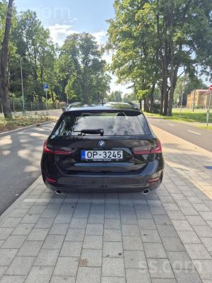 Black BMW 320 2022 in Riga, with an engine capacity of 2.00 L and mileage of 173 thousand km for 19900 €, photo 6 on AUTOMOTO.COM.LV