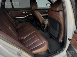 White BMW 320 2022 in Riga, with an engine capacity of 2.00 L and mileage of 174 thousand km for 21400 €, photo 13 on AUTOMOTO.COM.LV