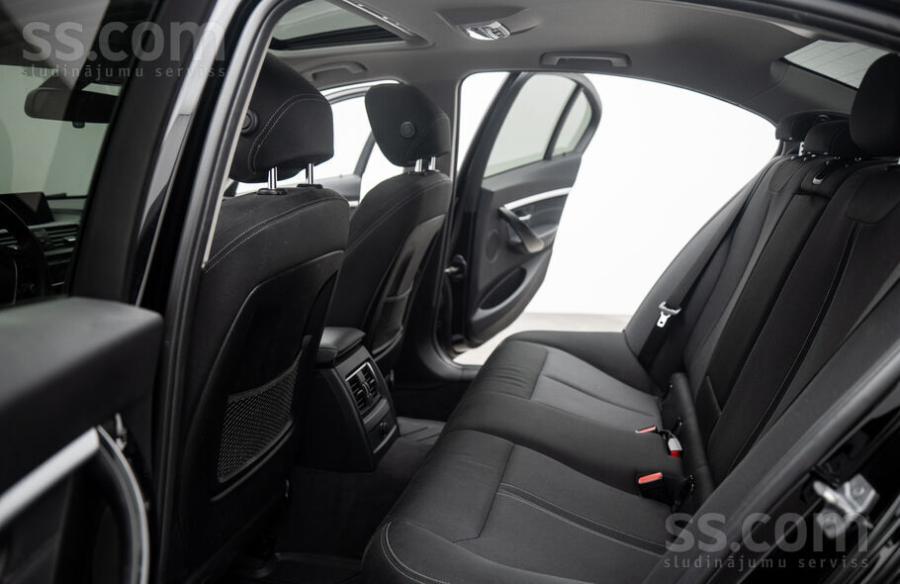 Black BMW 330 2017 in Riga, with an engine capacity of 2.00 L and mileage of 15 thousand km for 14999 €, photo 9 on AUTOMOTO.COM.LV