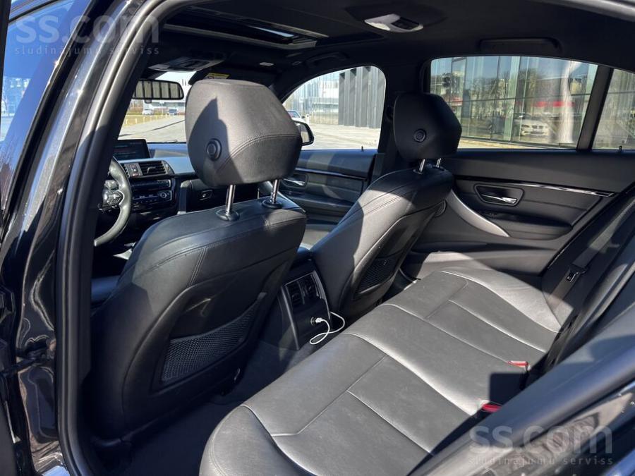 Black BMW 330 2017 in Riga, with an engine capacity of 3.00 L and mileage of 293 thousand km for 15900 €, photo 11 on AUTOMOTO.COM.LV