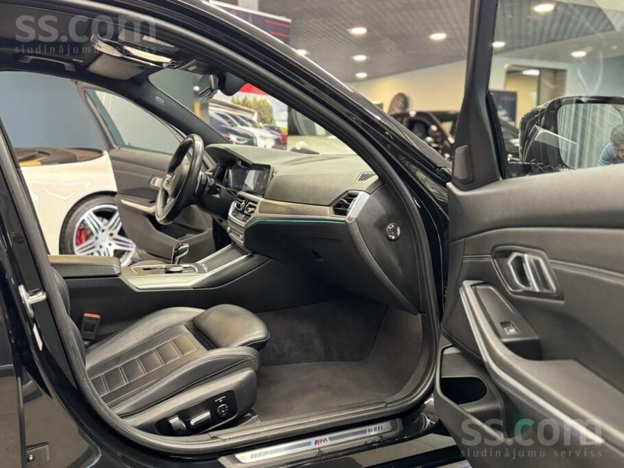 Black BMW 330 2019 in Riga, with an engine capacity of 2.00 L and mileage of 98 thousand km for 26995 €, photo 16 on AUTOMOTO.COM.LV