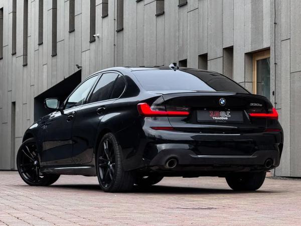 Black BMW 330 2020 in Riga, with an engine capacity of 2.00 L and mileage of 149 thousand km for 24300 €, photo 2 on AUTOMOTO.COM.LV