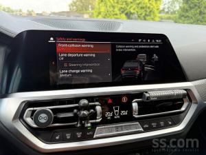 Black BMW 330 2021 in Bauska, with an engine capacity of 3.00 L and mileage of 48 thousand km for 35777 €, photo 19 on AUTOMOTO.COM.LV