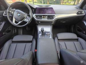Black BMW 330 2021 in Plunge, with an engine capacity of 2.00 L and mileage of 95 thousand km for 24000 €, photo 12 on AUTOMOTO.COM.LV