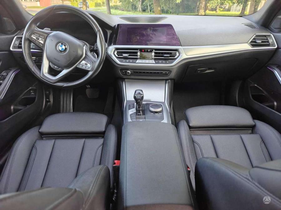 Black BMW 330 2021 in Plunge, with an engine capacity of 2.00 L and mileage of 95 thousand km for 24000 €, photo 12 on AUTOMOTO.COM.LV
