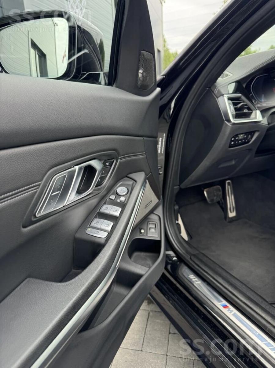 Black BMW 330 2021 in Riga, with an engine capacity of 2.00 L and mileage of 173 thousand km for 26990 €, photo 10 on AUTOMOTO.COM.LV
