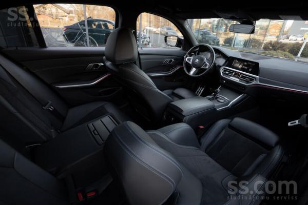Black BMW 330 2022 in Jelgava, with an engine capacity of 2.00 L and mileage of 109 thousand km for 34400 €, photo 10 on AUTOMOTO.COM.LV