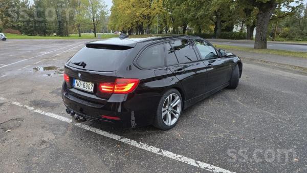 Black BMW 330 2012 in Riga, with an engine capacity of 3.00 L and mileage of 292 thousand km for 8800 €, photo 2 on AUTOMOTO.COM.LV