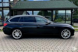Black BMW 330 2013 in Riga, with an engine capacity of 3.00 L and mileage of 322 thousand km for 10800 €, photo 1 on AUTOMOTO.COM.LV