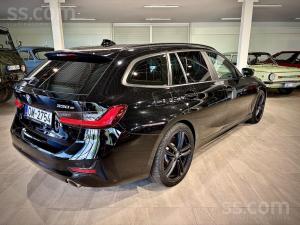 Black BMW 330 2021 in Dobele, with an engine capacity of 2.00 L and mileage of 230 thousand km for 20950 €, photo 4 on AUTOMOTO.COM.LV