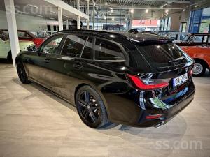 Black BMW 330 2021 in Dobele, with an engine capacity of 2.00 L and mileage of 230 thousand km for 20950 €, photo 6 on AUTOMOTO.COM.LV