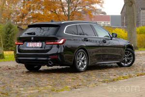 Black BMW 330 2021 in Jelgava, with an engine capacity of 2.00 L and mileage of 205 thousand km for 20900 €, photo 6 on AUTOMOTO.COM.LV