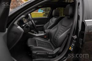 Black BMW 330 2021 in Jelgava, with an engine capacity of 2.00 L and mileage of 205 thousand km for 20900 €, photo 12 on AUTOMOTO.COM.LV