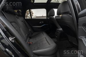 Black BMW 330 2021 in Jelgava, with an engine capacity of 2.00 L and mileage of 205 thousand km for 20900 €, photo 30 on AUTOMOTO.COM.LV