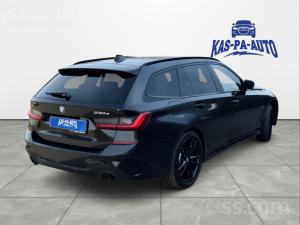 Black BMW 330 2021 in Riga, with an engine capacity of 2.00 L and mileage of 176 thousand km for 23999 €, photo 6 on AUTOMOTO.COM.LV