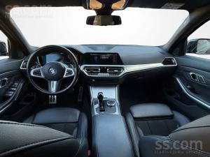 Black BMW 330 2021 in Riga, with an engine capacity of 2.00 L and mileage of 176 thousand km for 23999 €, photo 10 on AUTOMOTO.COM.LV