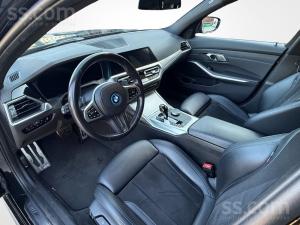Black BMW 330 2021 in Riga, with an engine capacity of 2.00 L and mileage of 176 thousand km for 23999 €, photo 11 on AUTOMOTO.COM.LV