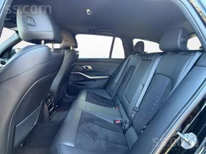 Black BMW 330 2021 in Riga, with an engine capacity of 2.00 L and mileage of 176 thousand km for 23999 €, photo 13 on AUTOMOTO.COM.LV