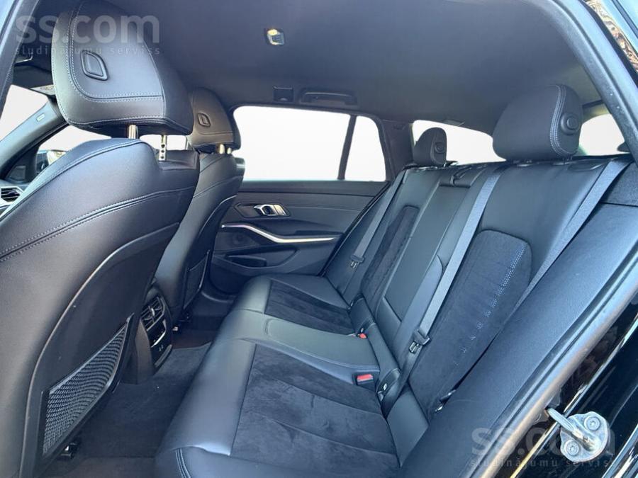 Black BMW 330 2021 in Riga, with an engine capacity of 2.00 L and mileage of 176 thousand km for 23999 €, photo 13 on AUTOMOTO.COM.LV