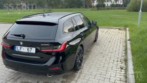 Black BMW 330 2021 in Dobele, with an engine capacity of 2.00 L and mileage of 209 thousand km for 20595 €, photo 6 on AUTOMOTO.COM.LV