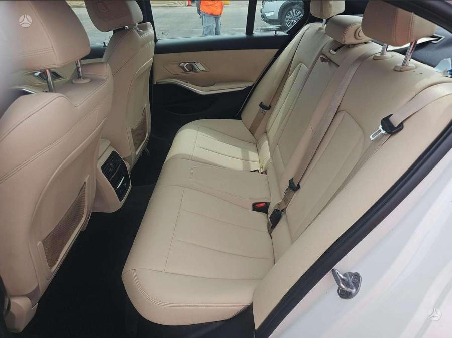 White BMW 330 2020 in Ukmerge, with an engine capacity of 2.00 L and mileage of 301 thousand km for 13100 €, photo 8 on AUTOMOTO.COM.LV
