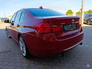 Red BMW 335 2013 in Kretinga, with an engine capacity of 2.98 L and mileage of 217 thousand km for 12200 €, photo 7 on AUTOMOTO.COM.LV