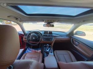 Red BMW 335 2013 in Kretinga, with an engine capacity of 2.98 L and mileage of 217 thousand km for 12200 €, photo 13 on AUTOMOTO.COM.LV