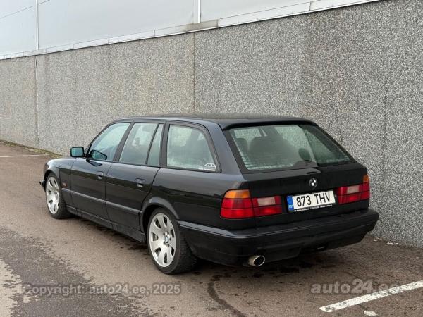 Black BMW 5 Series 1995 in Tallinn, with an engine capacity of 4.00 L and mileage of 321 thousand km for 7999 €, photo 6 on AUTOMOTO.COM.LV