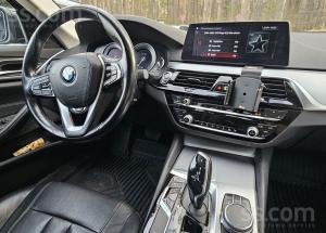 Black BMW 520 2017 in Riga, with an engine capacity of 2.00 L and mileage of 123 thousand km for 21000 €, photo 8 on AUTOMOTO.COM.LV